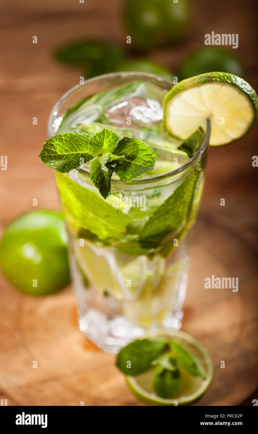 Mojito cocktail on wooden background Stock Photo - Alamy