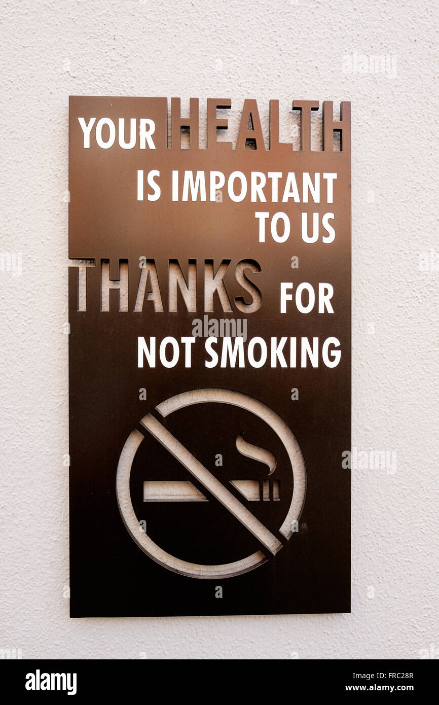 Typography sign says your health is important to us thanks for not ...