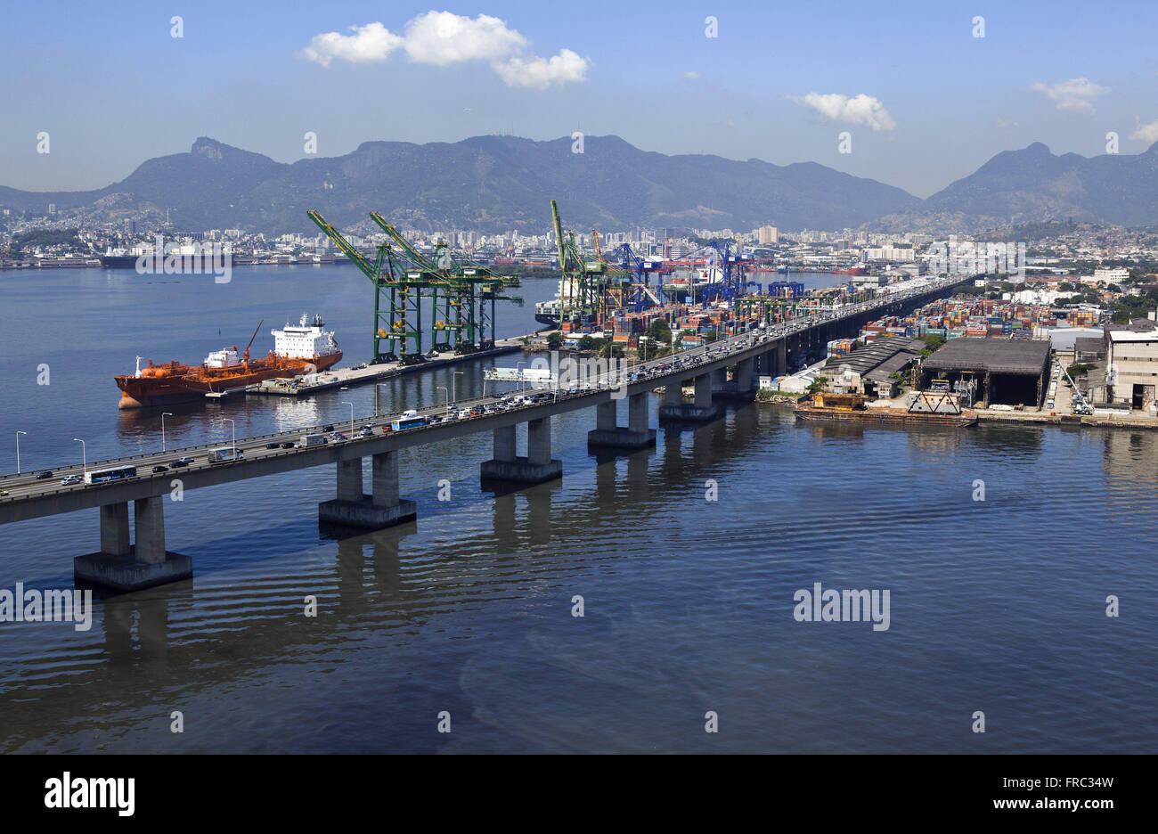 Aerial view of the Rio-Niteroi Bridge and cranes at the port in the Bay ...