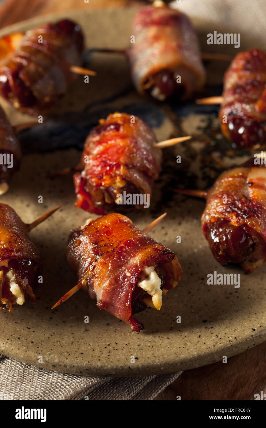 Homemade Bacon Wrapped Dates with Goat Cheese Stock Photo - Alamy