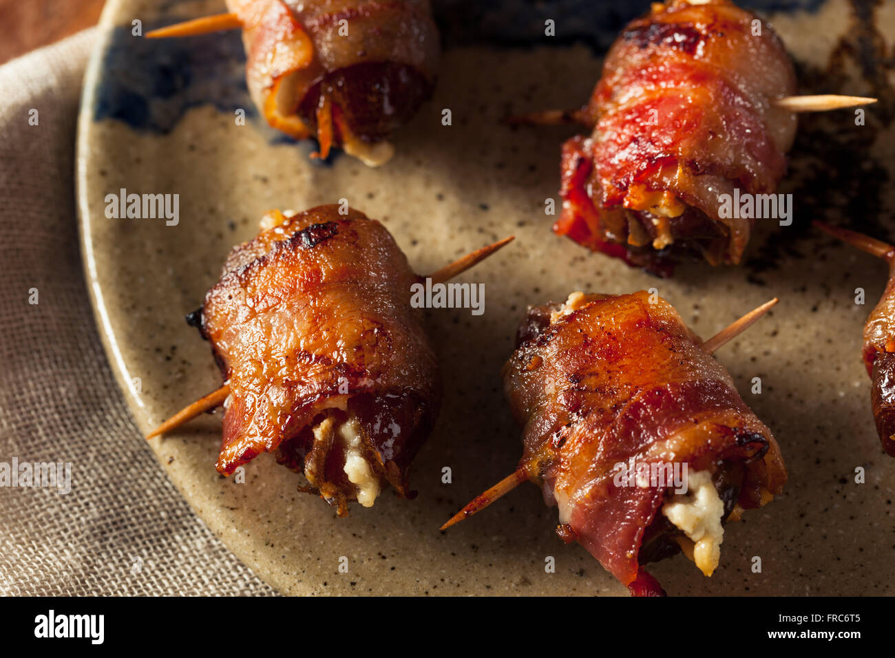 Homemade Bacon Wrapped Dates with Goat Cheese Stock Photo - Alamy