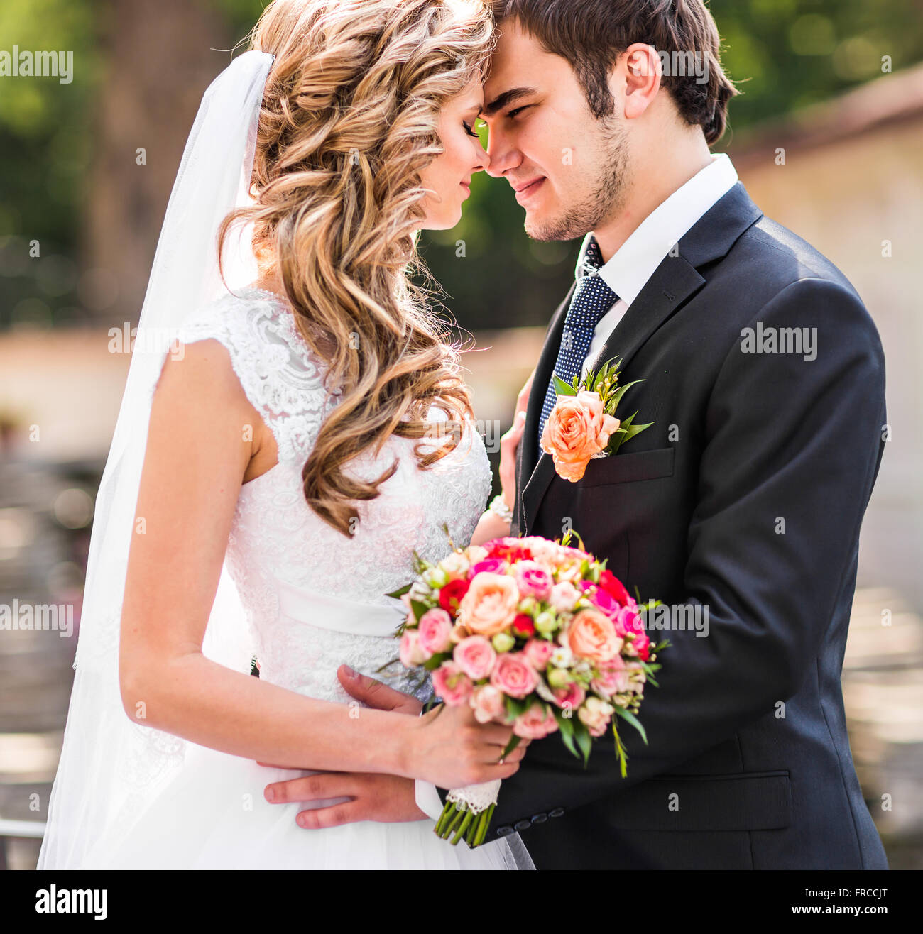 Just married couple embraced Stock Photo - Alamy