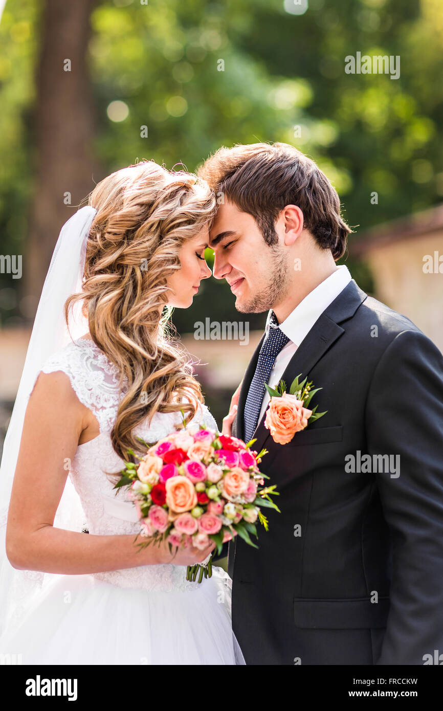 Bride and groom having a romantic moment on their wedding day Stock ...