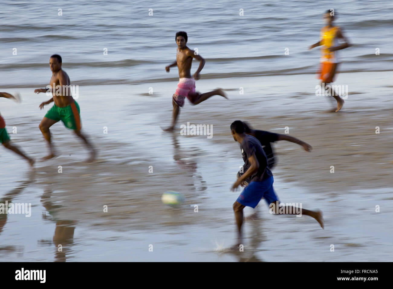 Football at beach hi-res stock photography and images - Alamy
