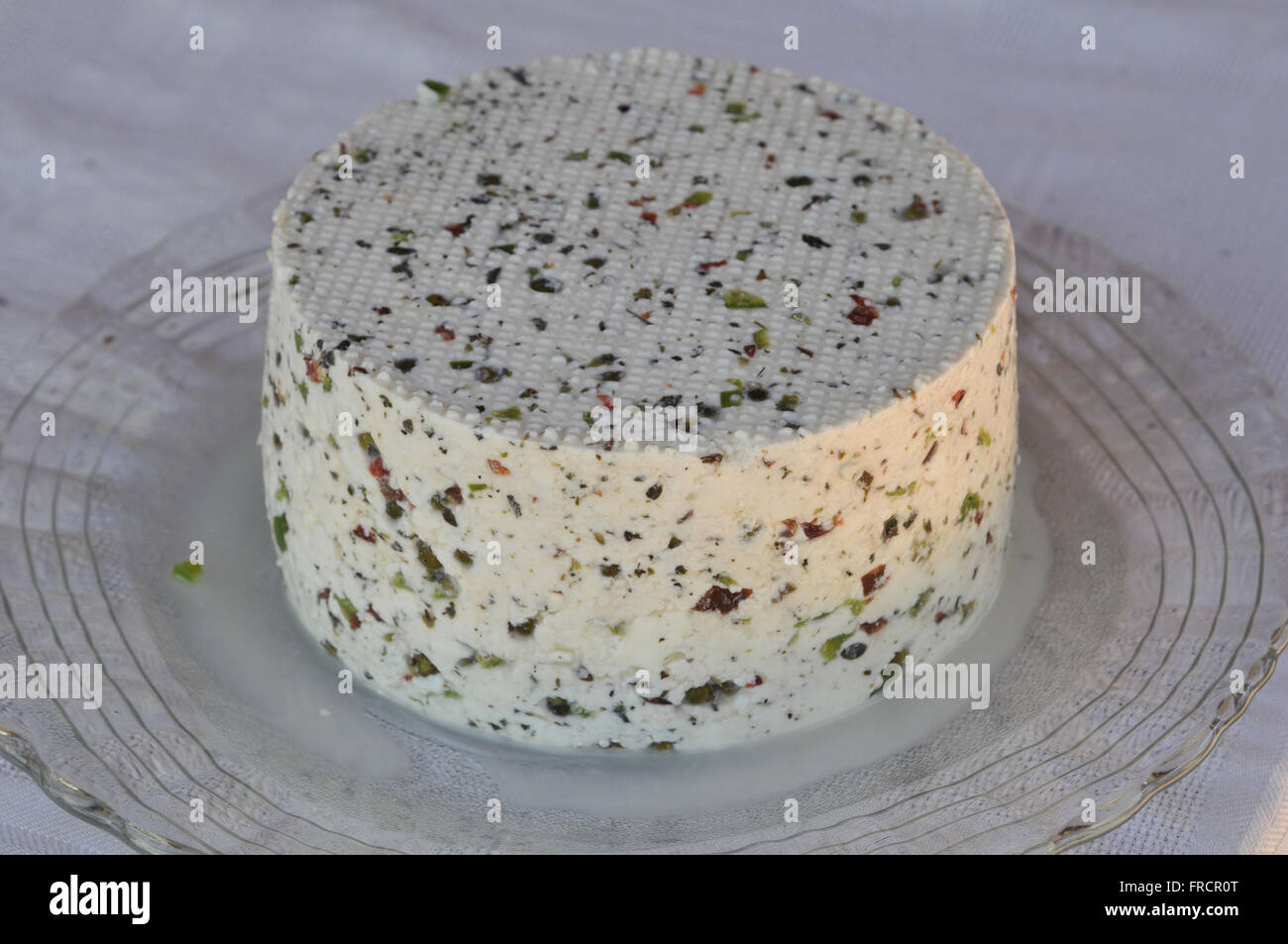 Cheese with peppers in the countryside Stock Photo - Alamy