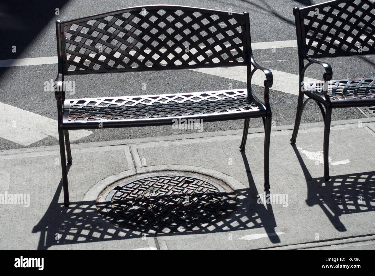 Metal benches on a sidewalk in Downtown New York City Stock Photo - Alamy