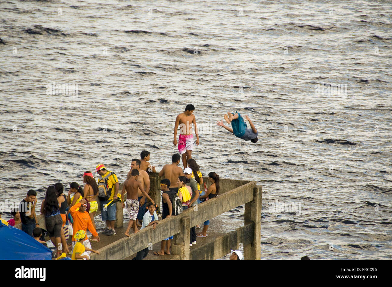 Teens dive in Rio Negro in the region of Ponta Negra Stock Photo - Alamy