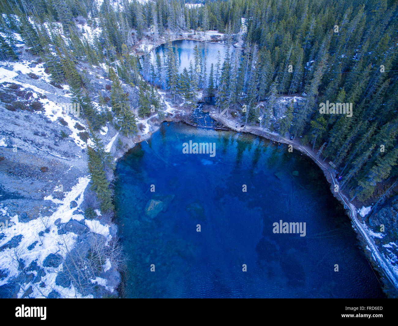 Small glacier lake in Canmore Alberta surrounded by the rockies Stock ...