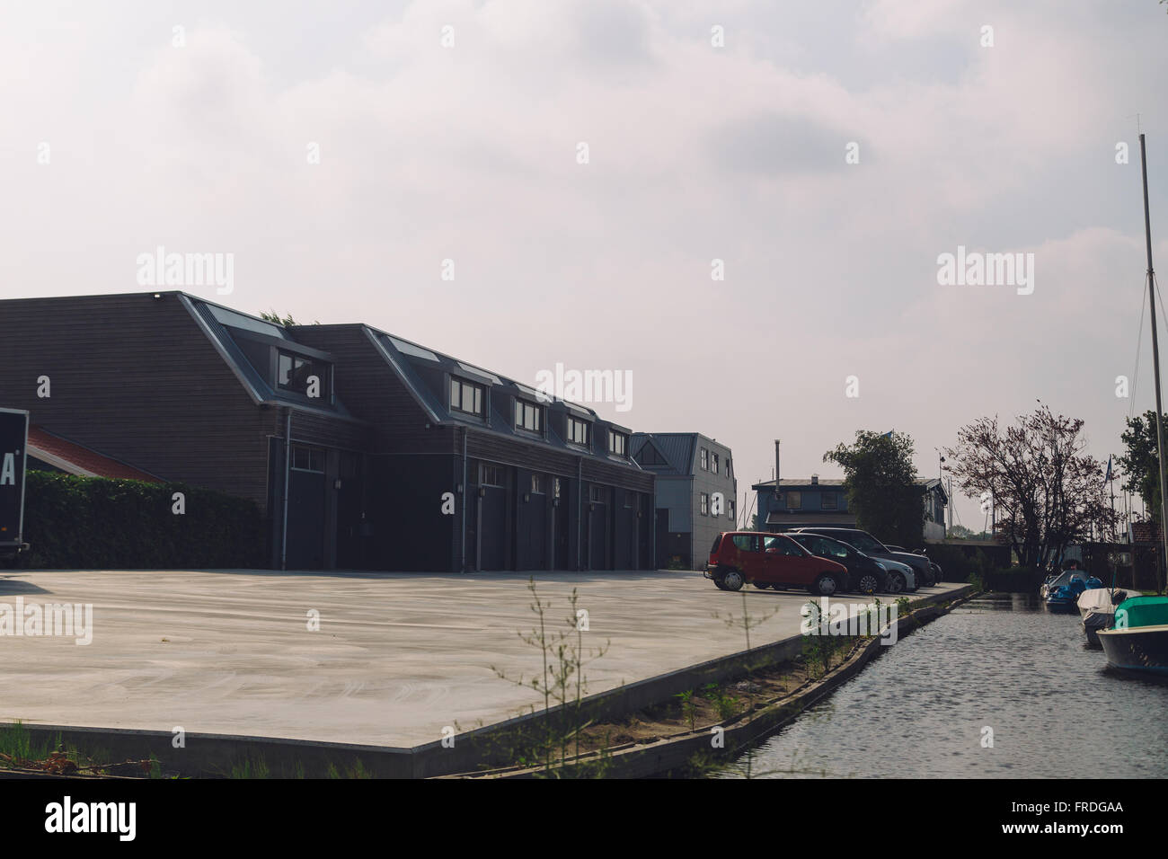 cars and water outside building Stock Photo - Alamy