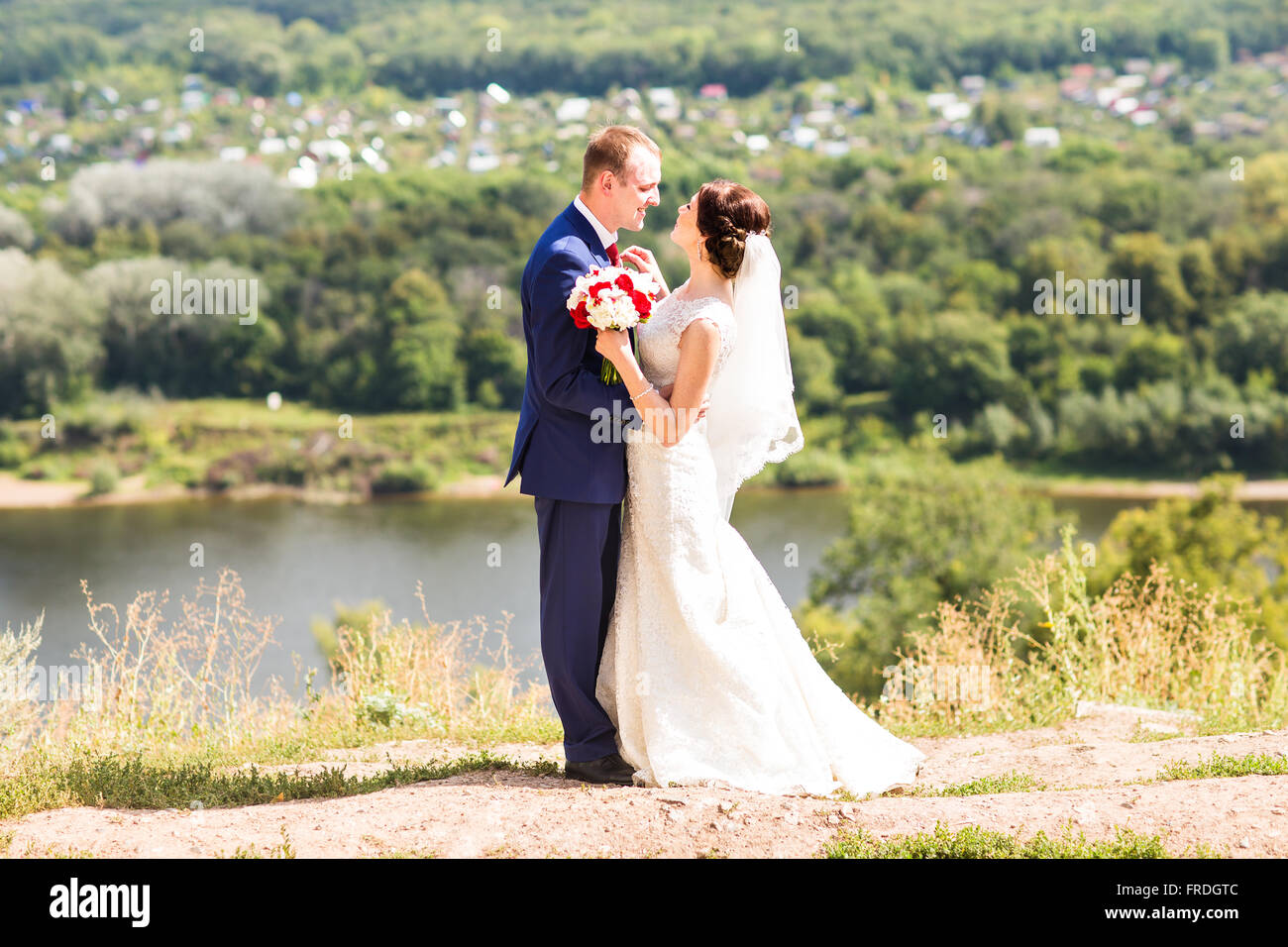 Bride and groom having a romantic moment on their wedding day Stock ...