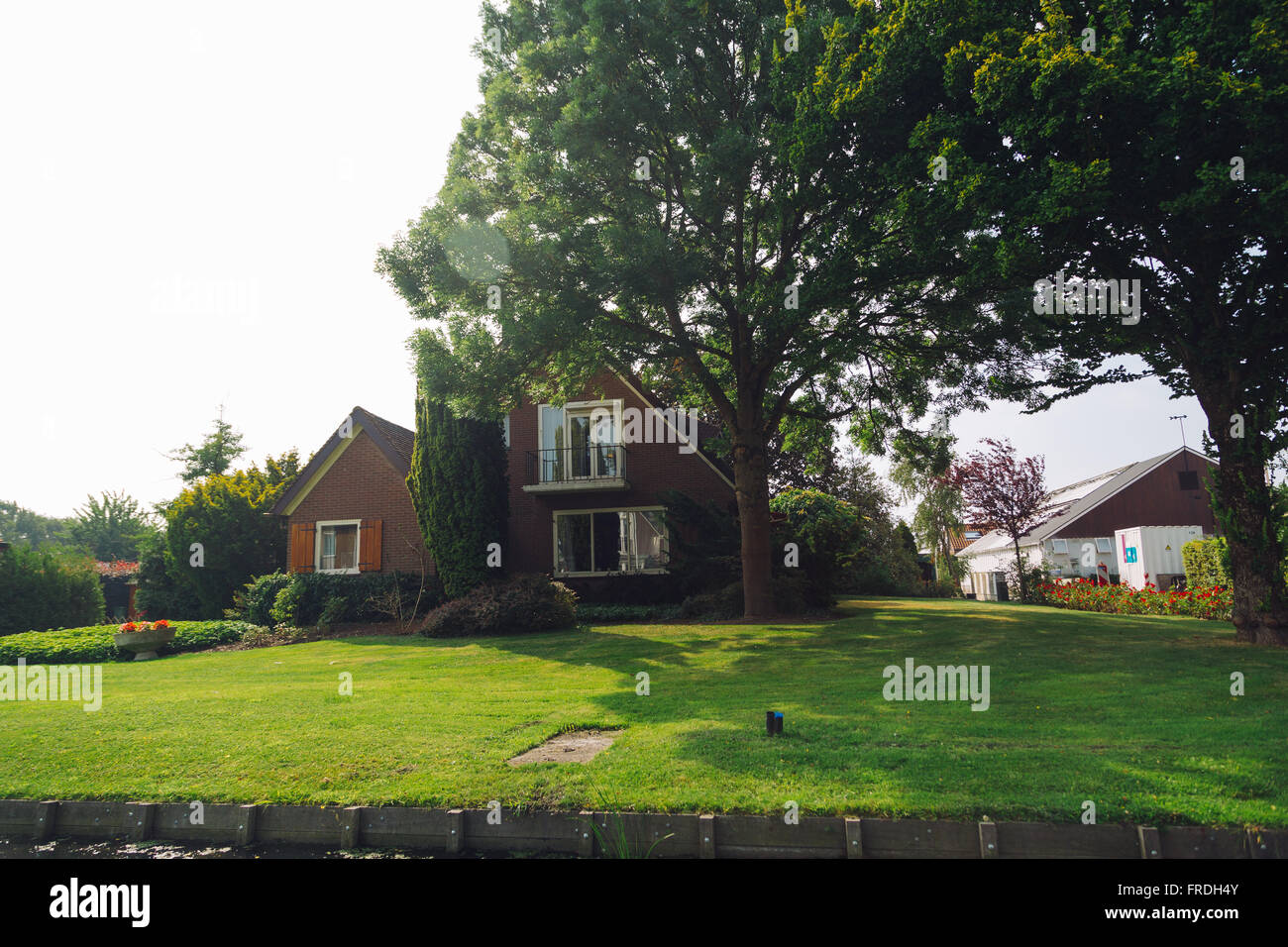 grass and tree outside the house Stock Photo - Alamy