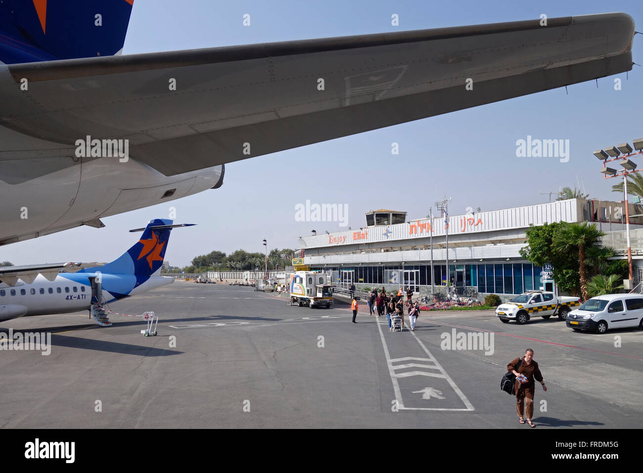 Passengers boarding Israeli airlines at the runway of Eilat airport ...