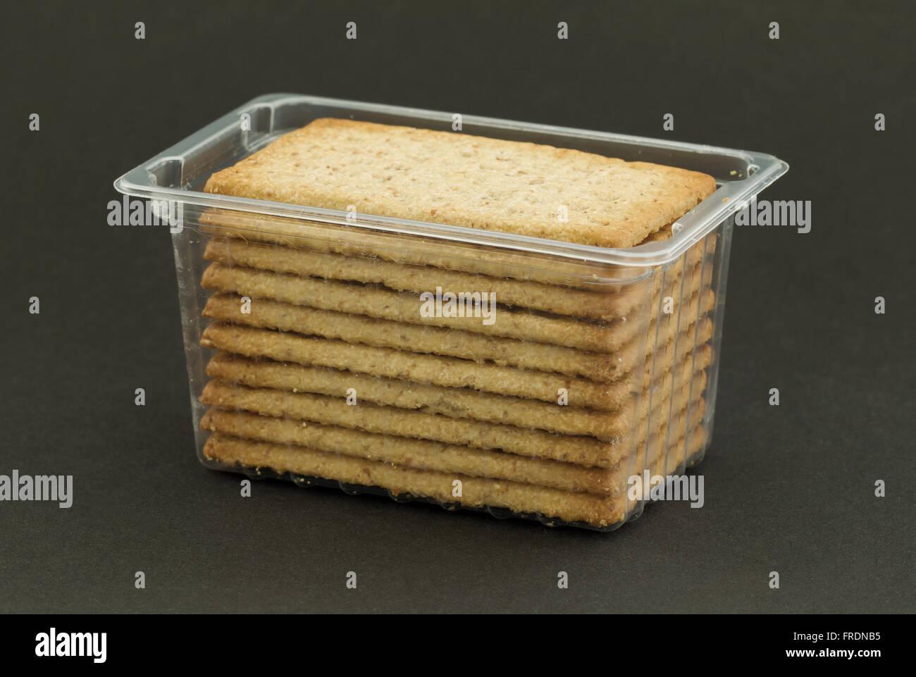 Crackers in plastic, isolated on a grey background Stock Photo - Alamy