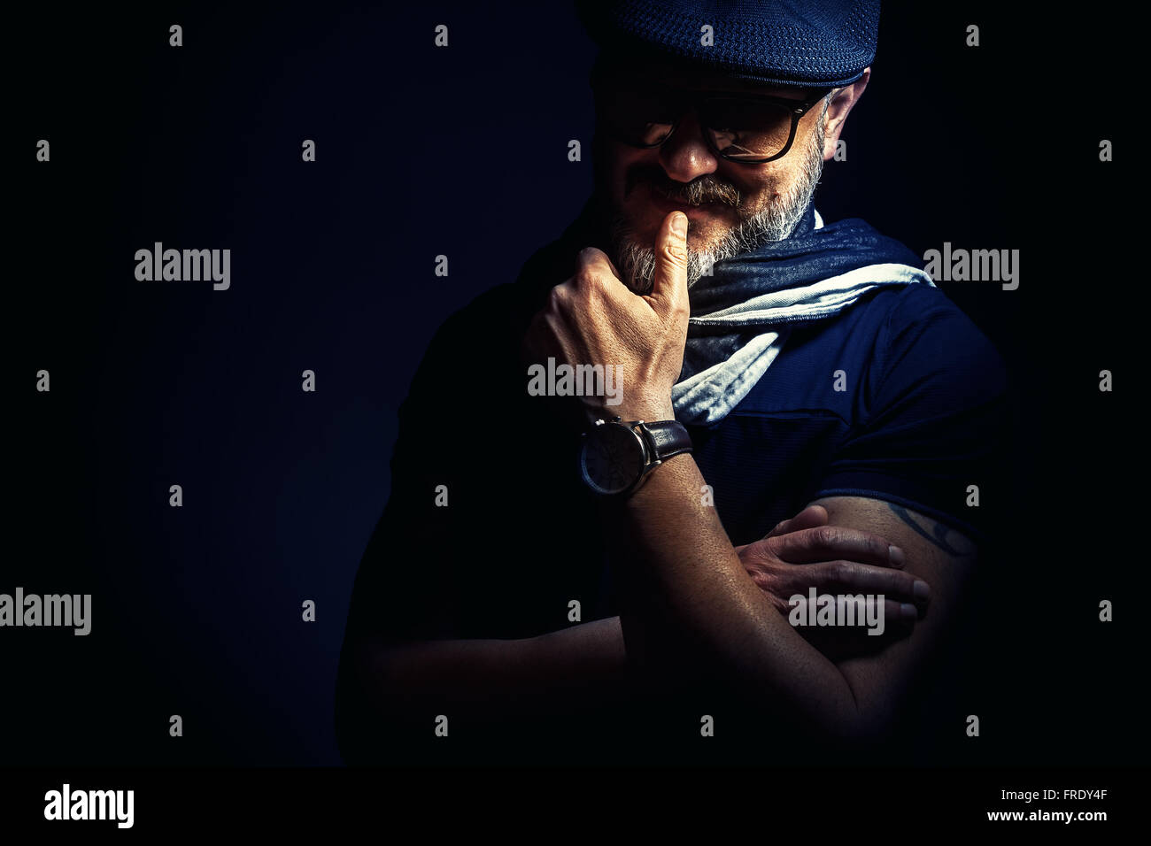 Relaxed middle aged man, low light, accentuated shapes of face Stock ...