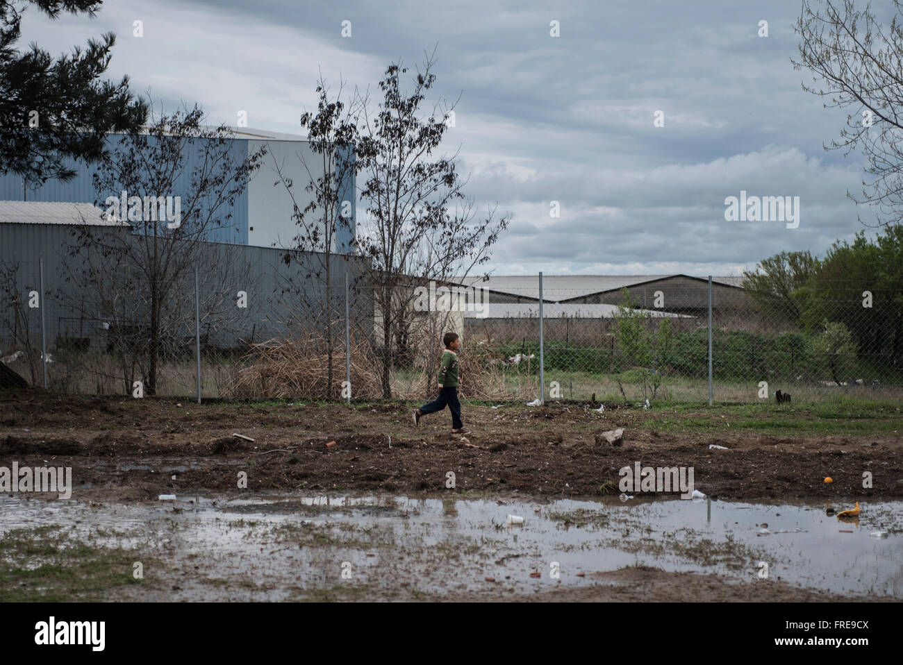 A boy runs inside the Diavata refugee camp near the northern Greek city ...
