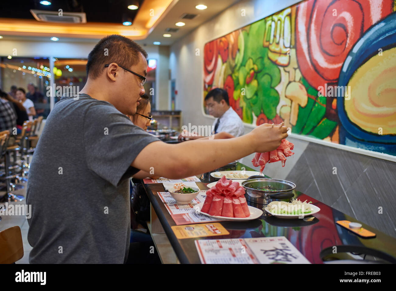 Beijing , China - September 24, 2014: people eating Chinese Hot pot in ...