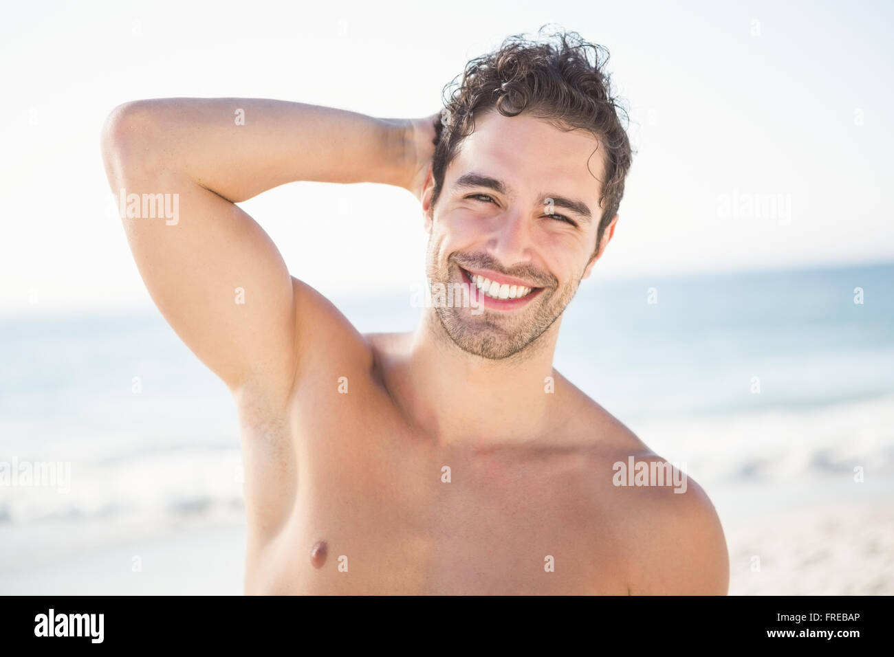 Smiling fit man posing Stock Photo - Alamy