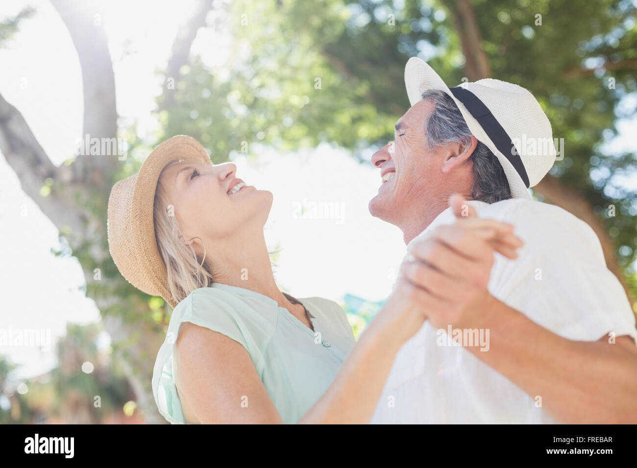 Cheerful mature couple holding hands hi-res stock photography and images - Alamy