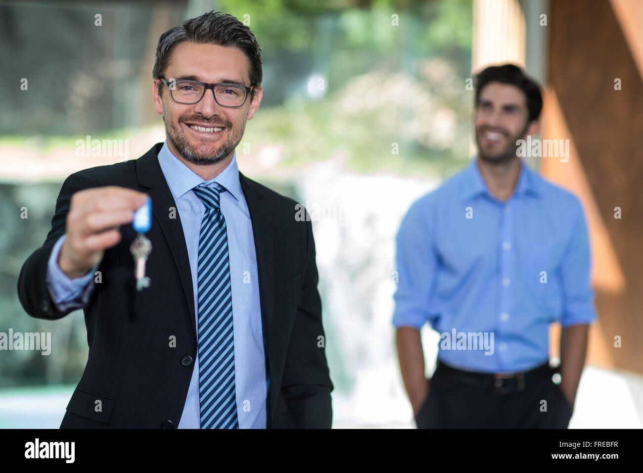 Male estate agent holding hi-res stock photography and images - Alamy