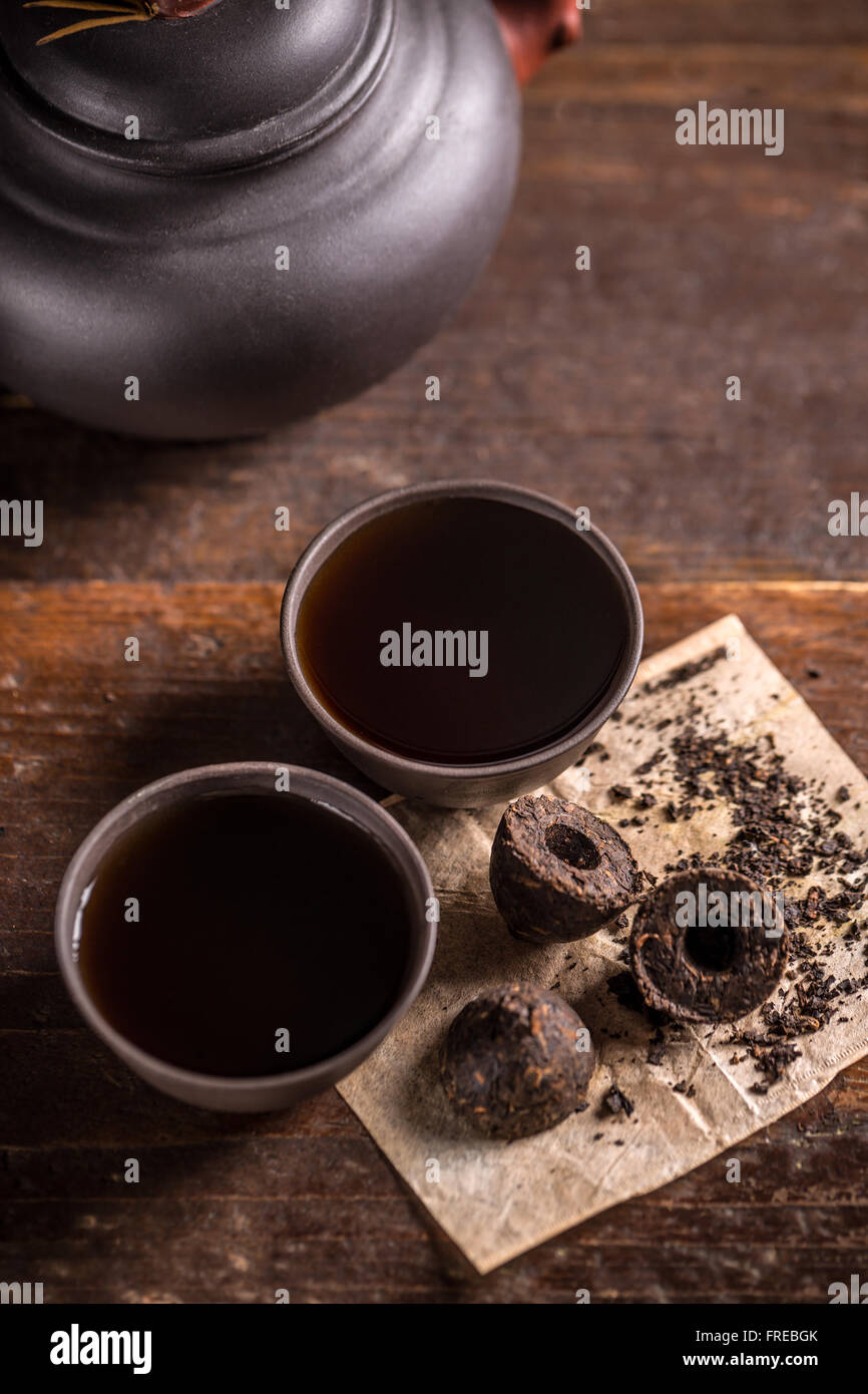 Cups of black tea with pressed tea leaves Stock Photo - Alamy