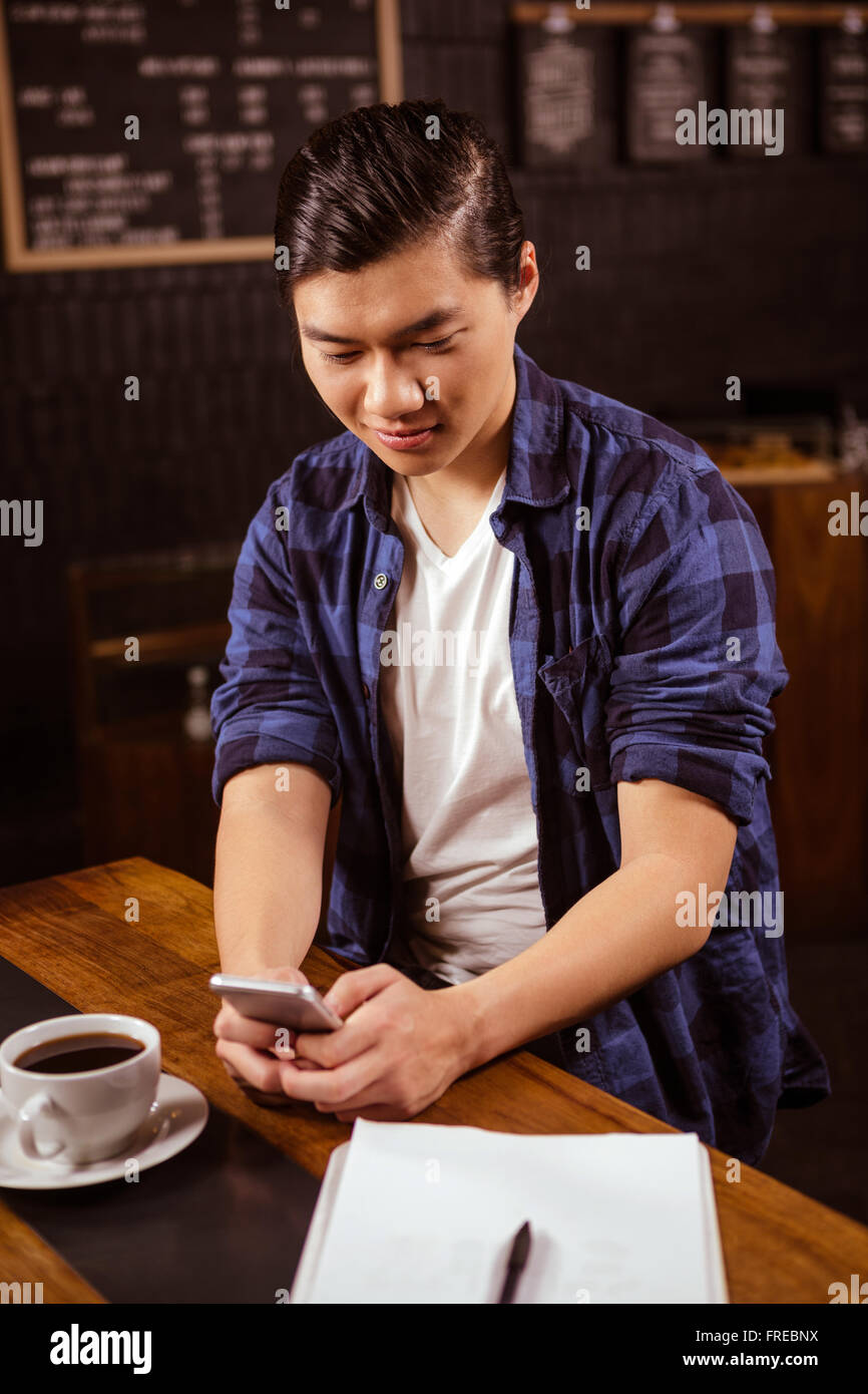 Man using his smartphone Stock Photo - Alamy