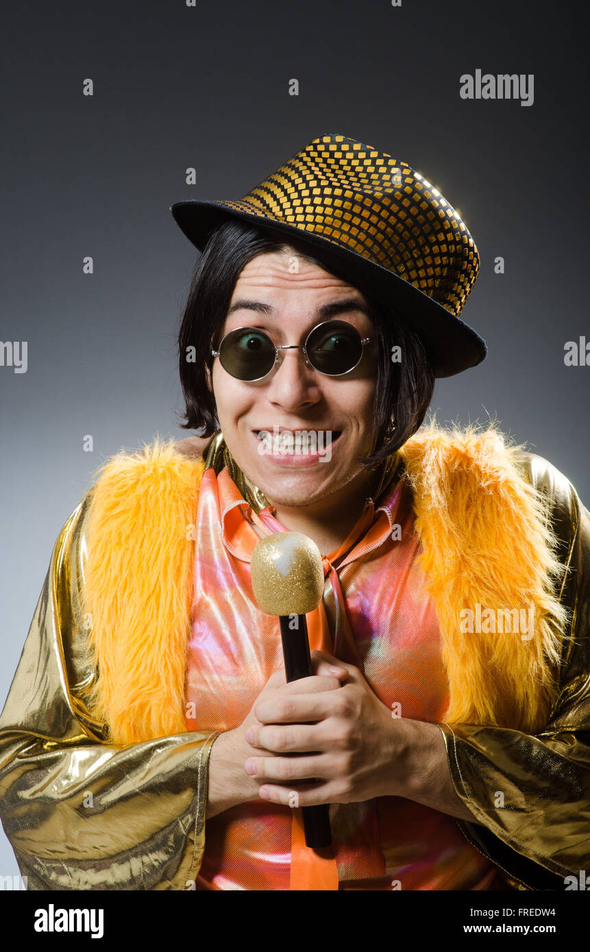 Young man singing in karaoke club Stock Photo - Alamy