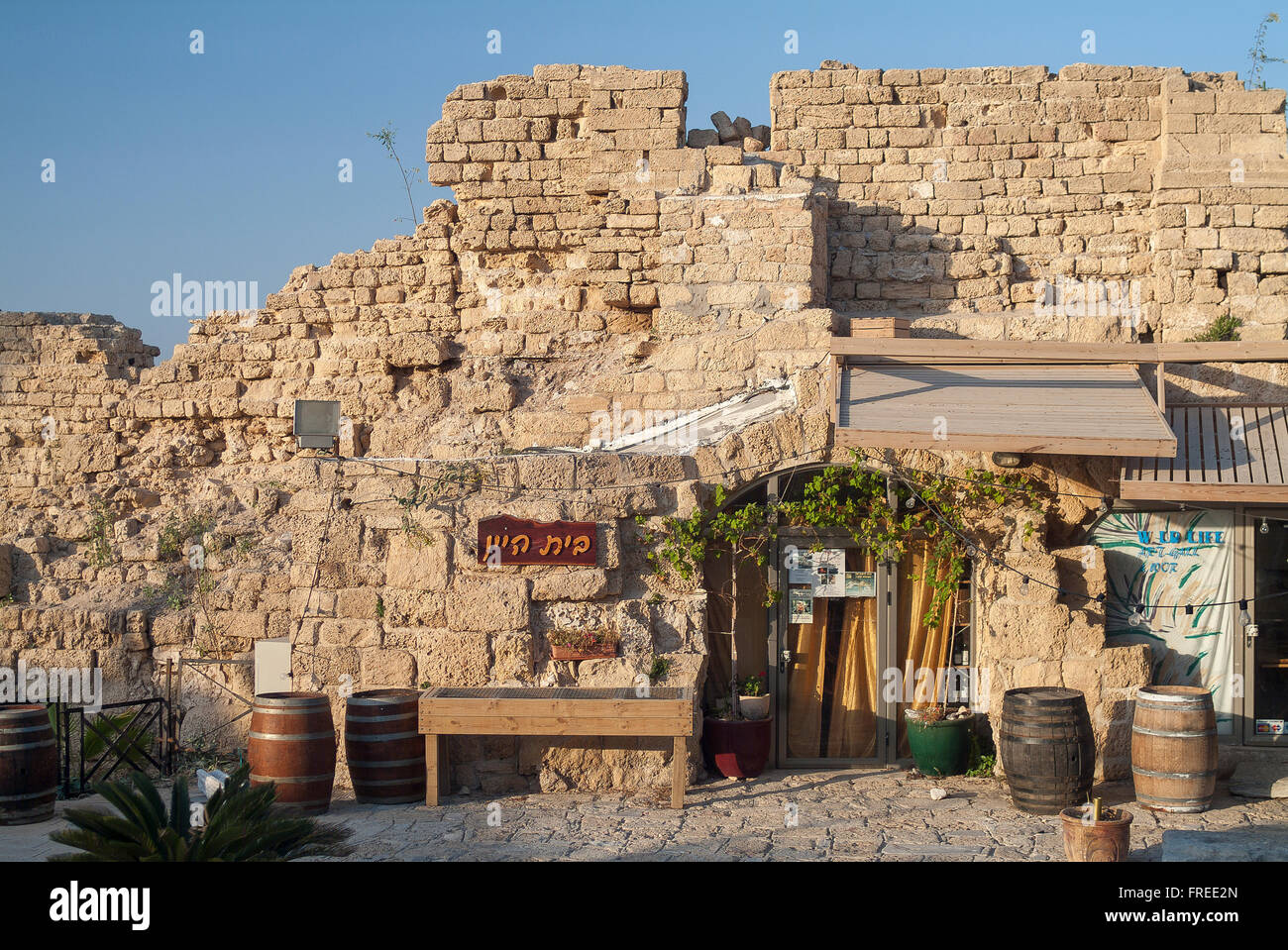Rustic wine bar at fortress wall, archaeological excavation, ancient ...