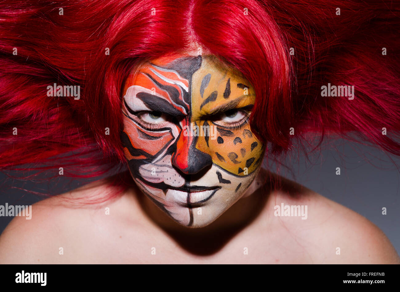 Woman with tiger face in halloween concept Stock Photo - Alamy