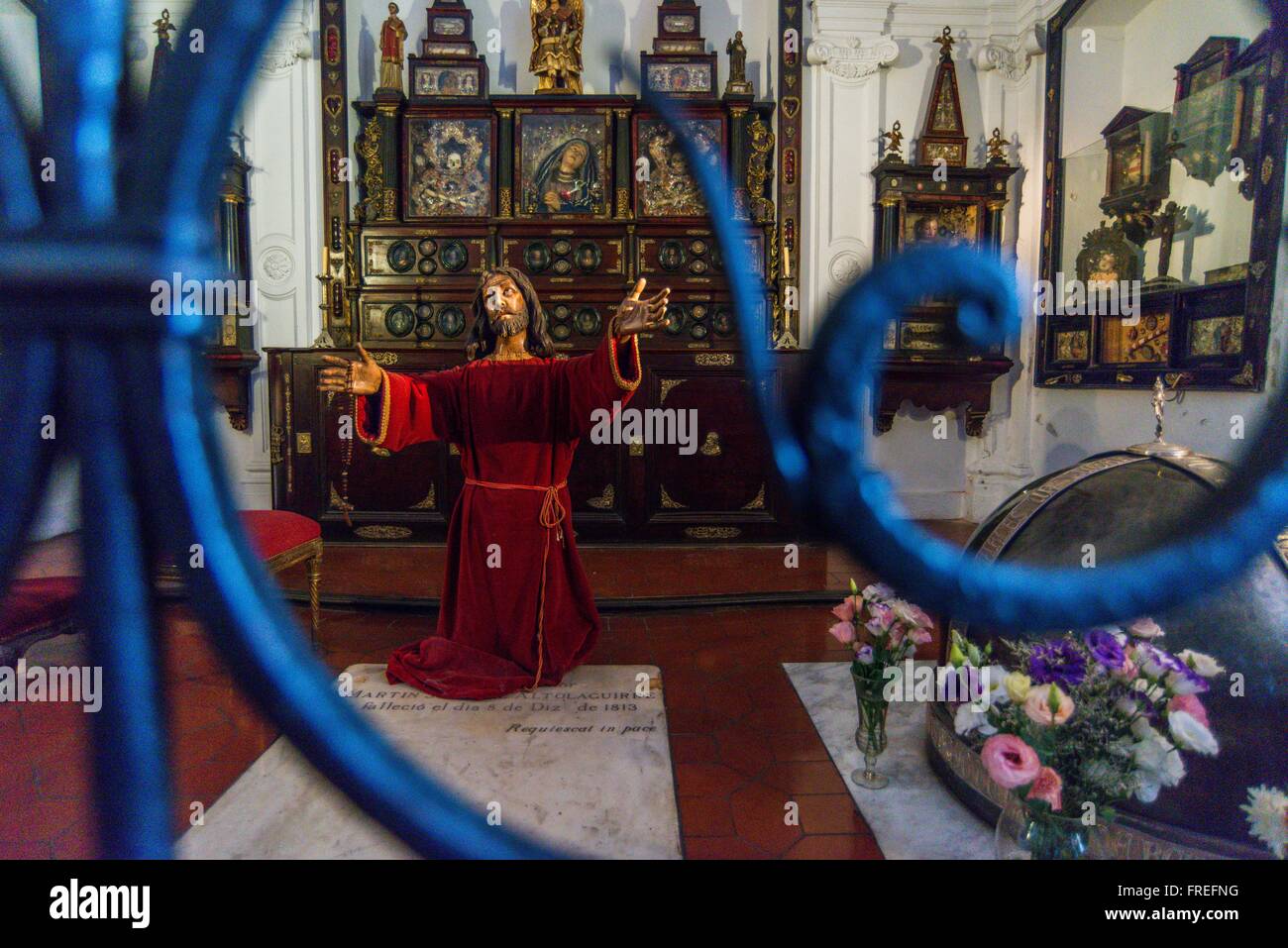 Statue of Jesus through wrought iron gate Stock Photo - Alamy