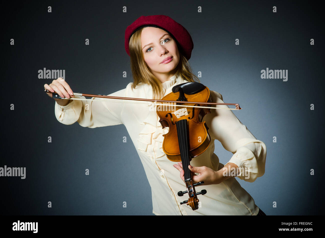 Woman violin player in musical concept Stock Photo - Alamy