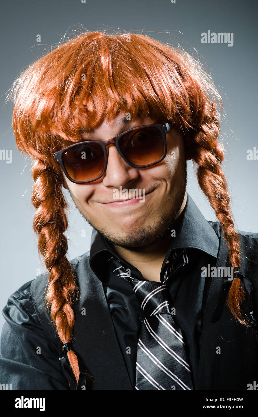 Funny man with red hair wig Stock Photo - Alamy