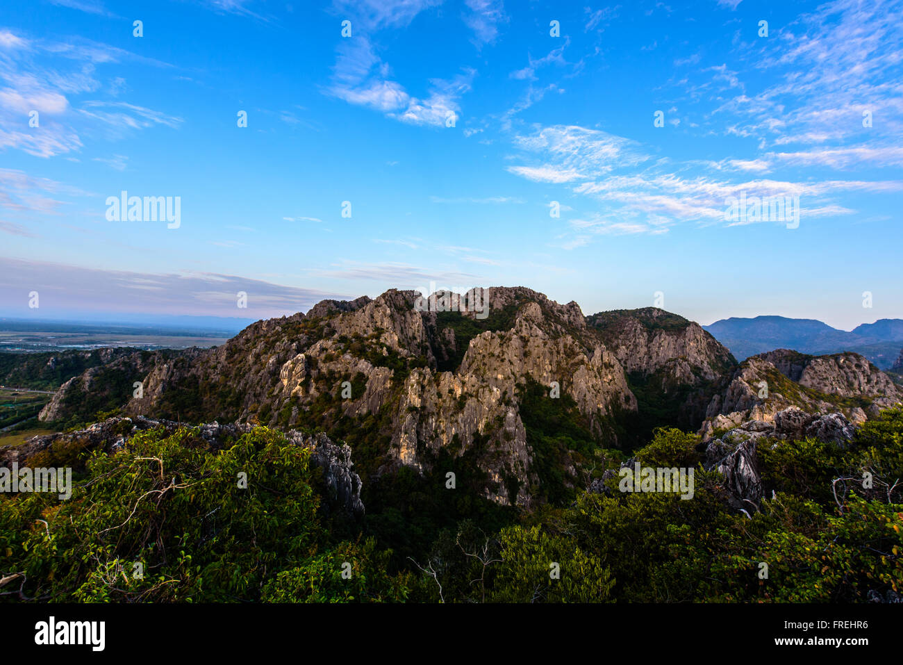 rock mountain cliff and blue sky background Stock Photo - Alamy
