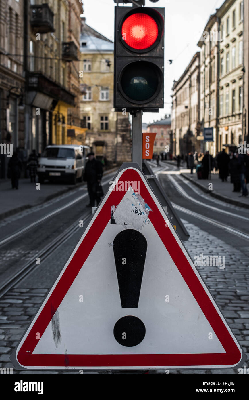 Warning sign on the road. Red traffic light Stock Photo - Alamy