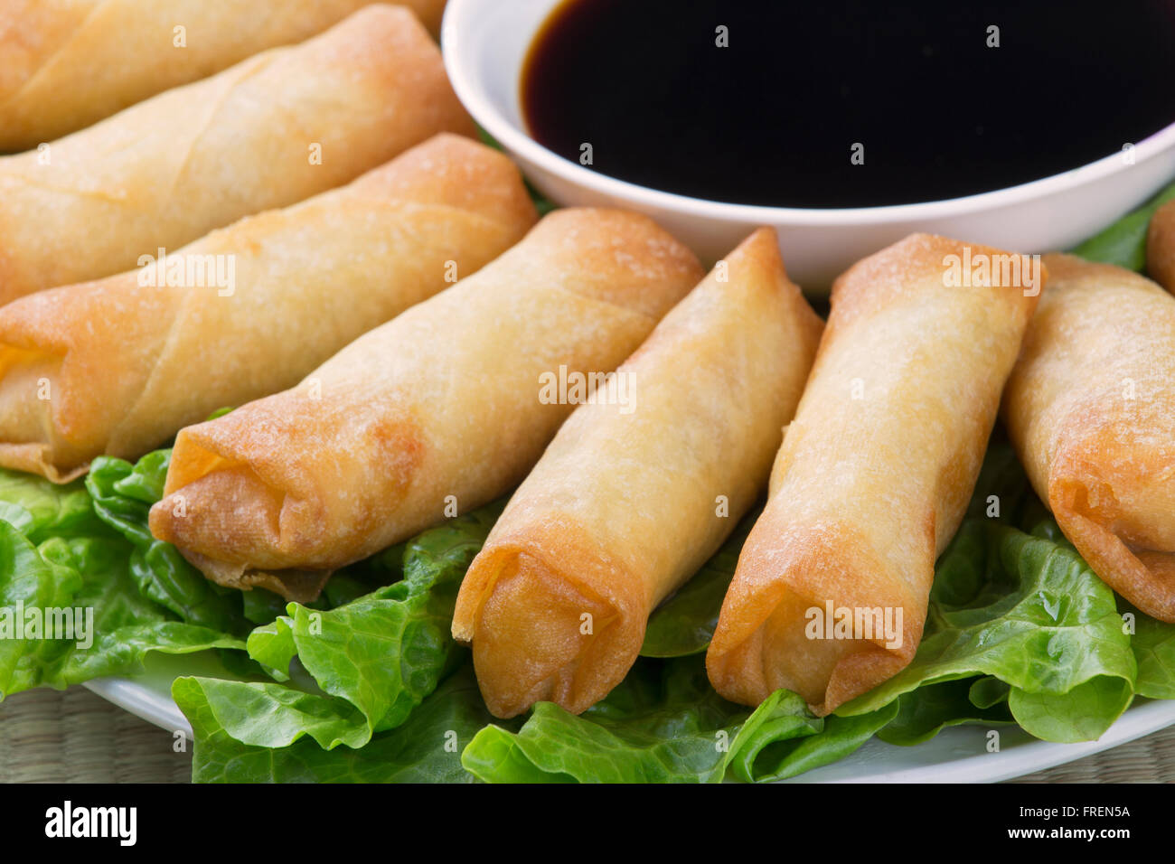 Traditional Chinese Spring Rolls with a dipping sause of soy sause ...