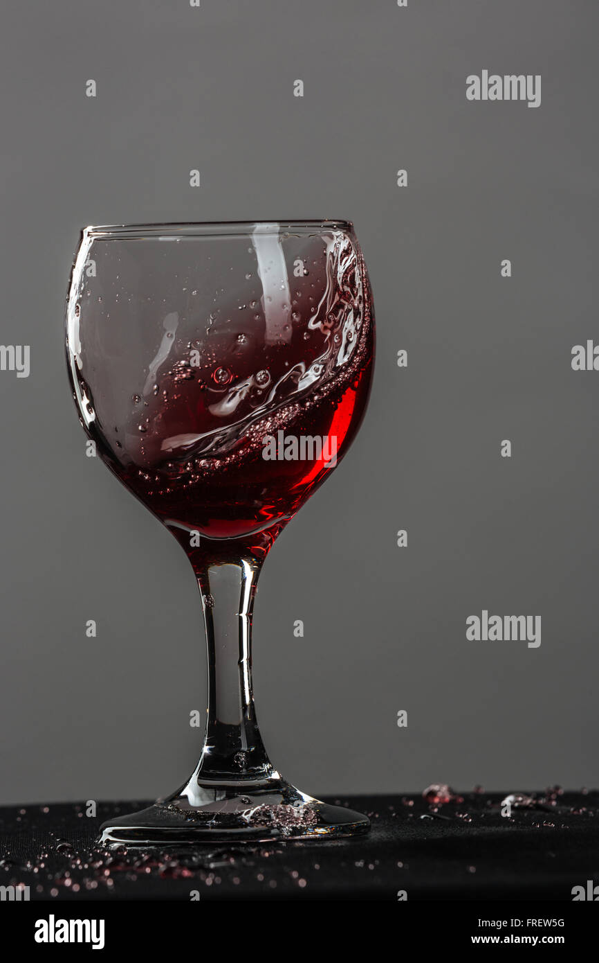 Red wine splash in glass Stock Photo - Alamy