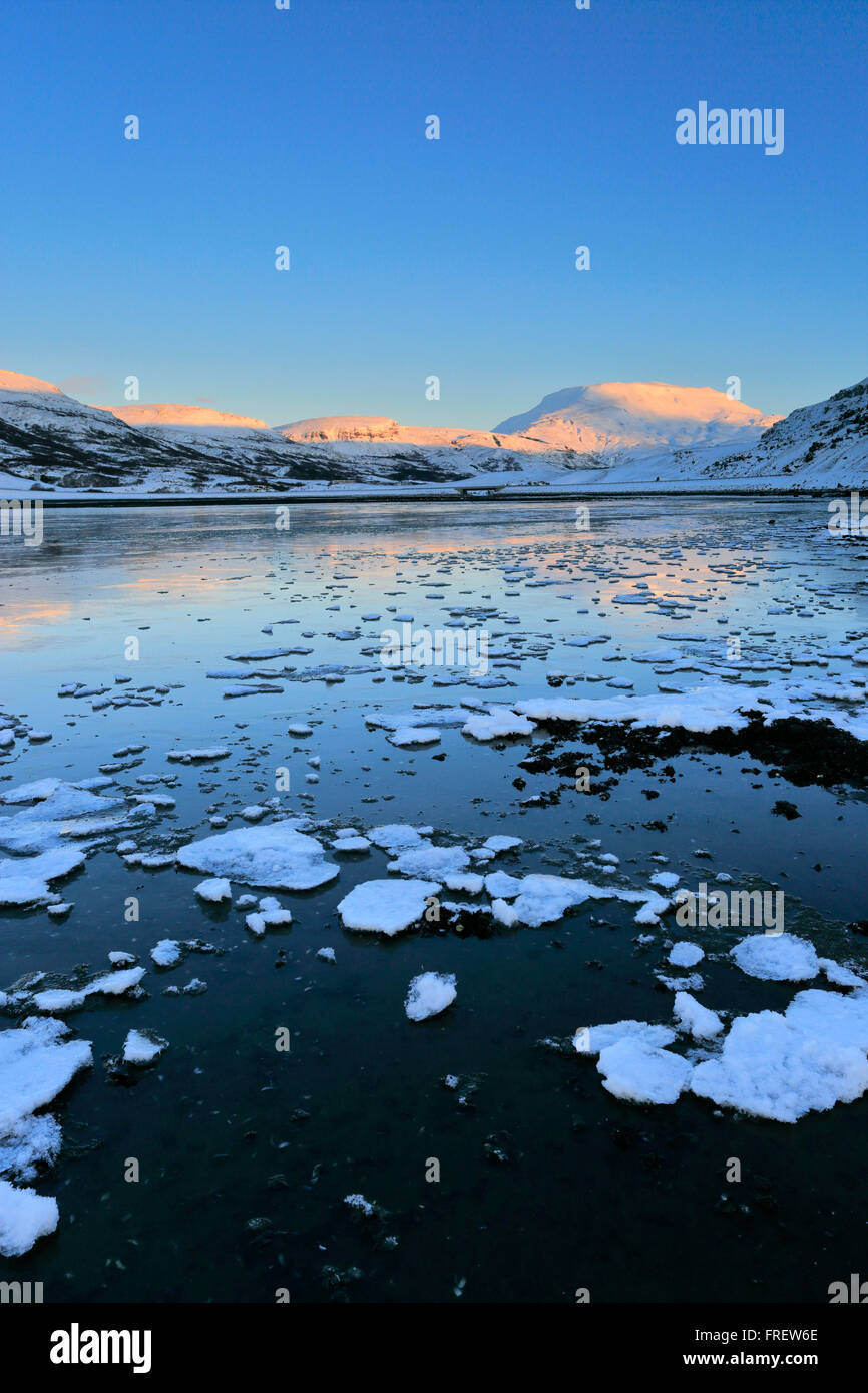 Sunrise over the frozen Hvalfjördur Fjord, Capital Region, West coast ...