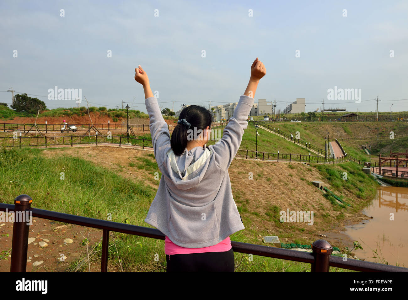 woman standing with hands up /Future / freedom / hope / success concept ...
