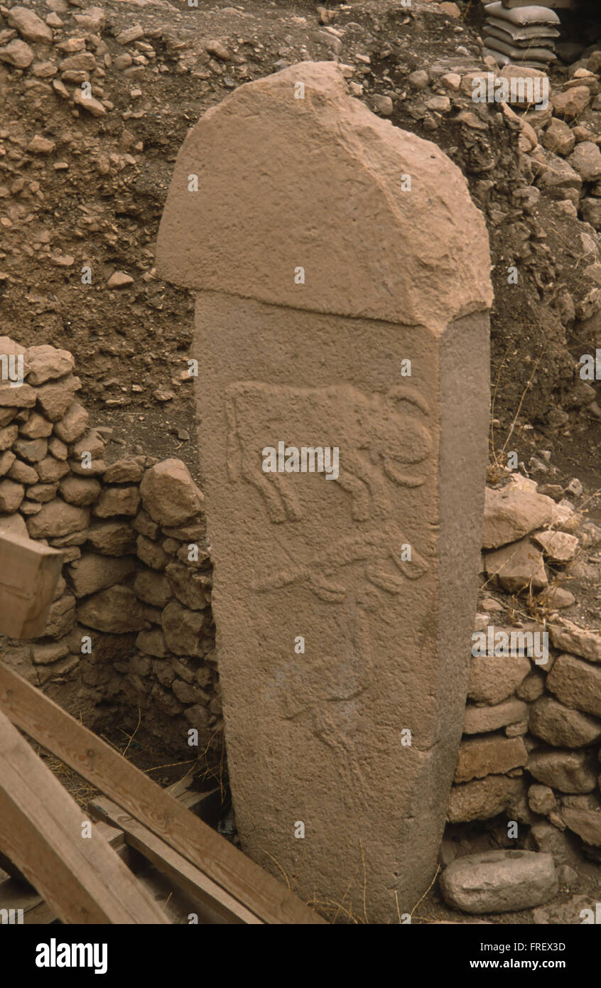 Carved stele with animal reliefs at early Neolithic site of Gobekli ...