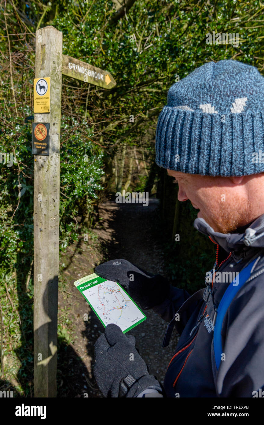 Male walker checking his card map at the start of the Edale/Kinder ...