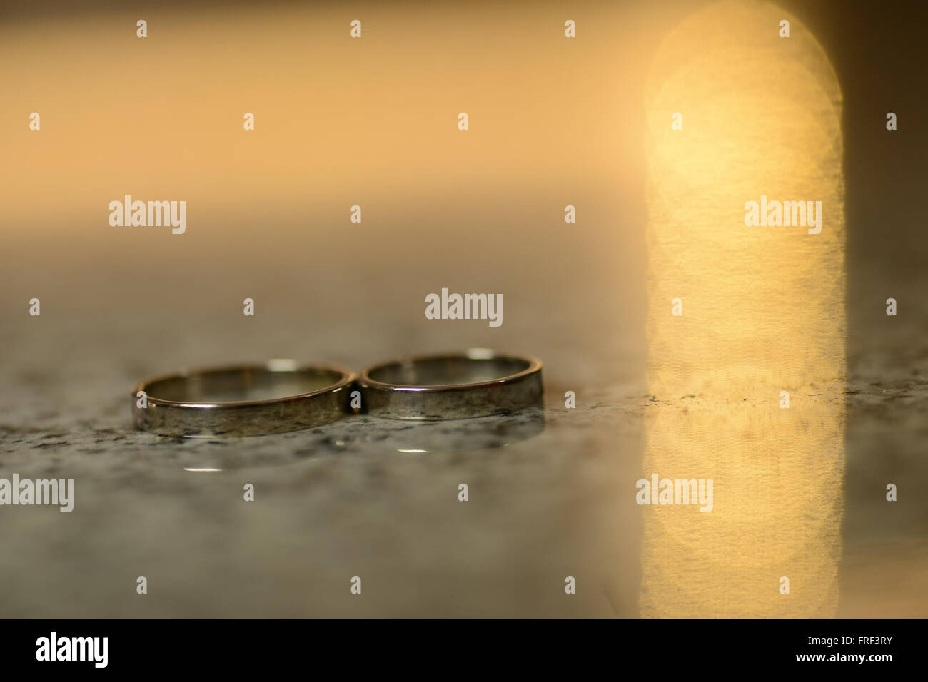 Wedding ring with shaped bokeh Stock Photo - Alamy