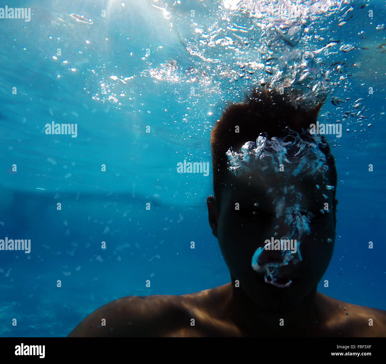 Boy breathing under water Stock Photo - Alamy