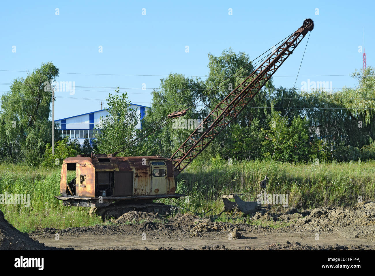 Old quarry near the dragline. Old equipment for digging the soil in ...