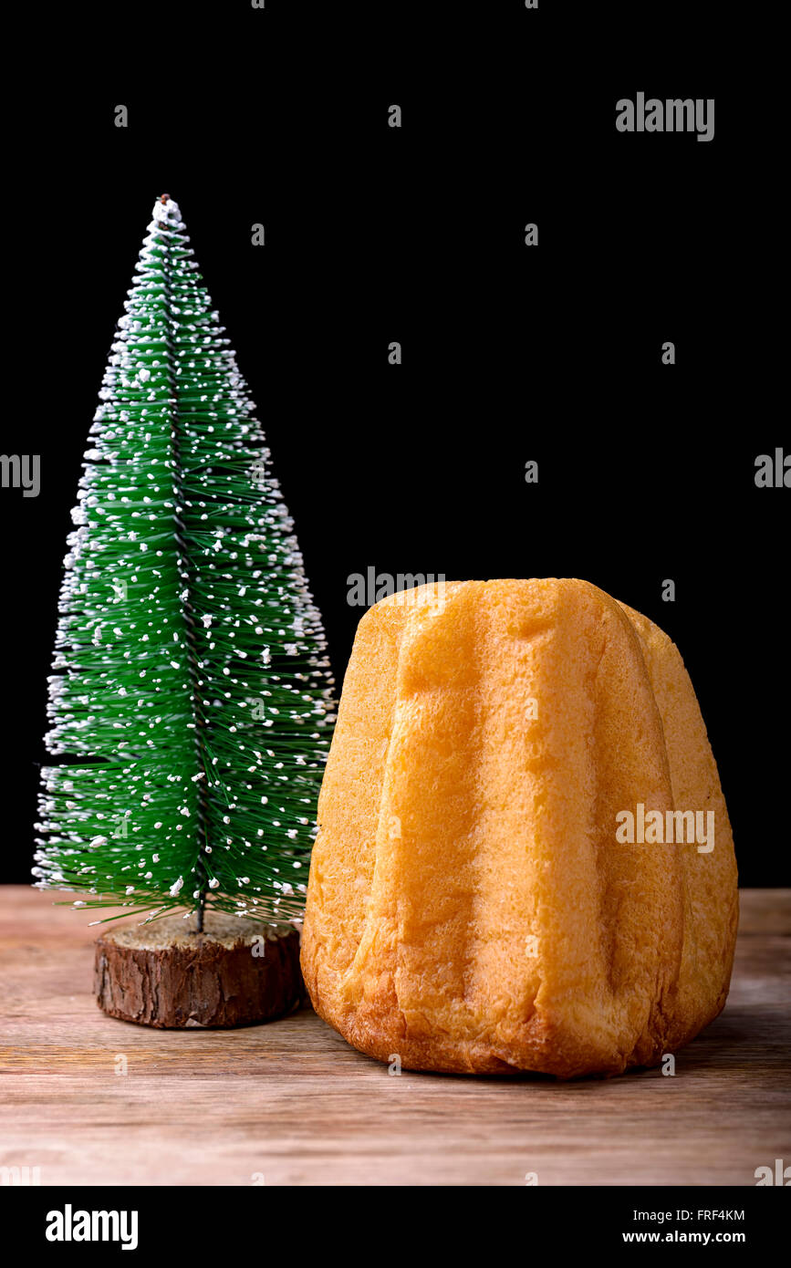 pandoro cake and christmas tree on wood and black background Stock ...