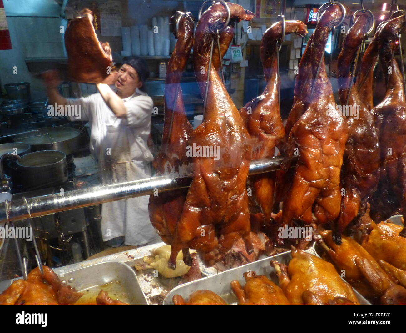 Peking ducks hang in Chinese restaurant Stock Photo - Alamy