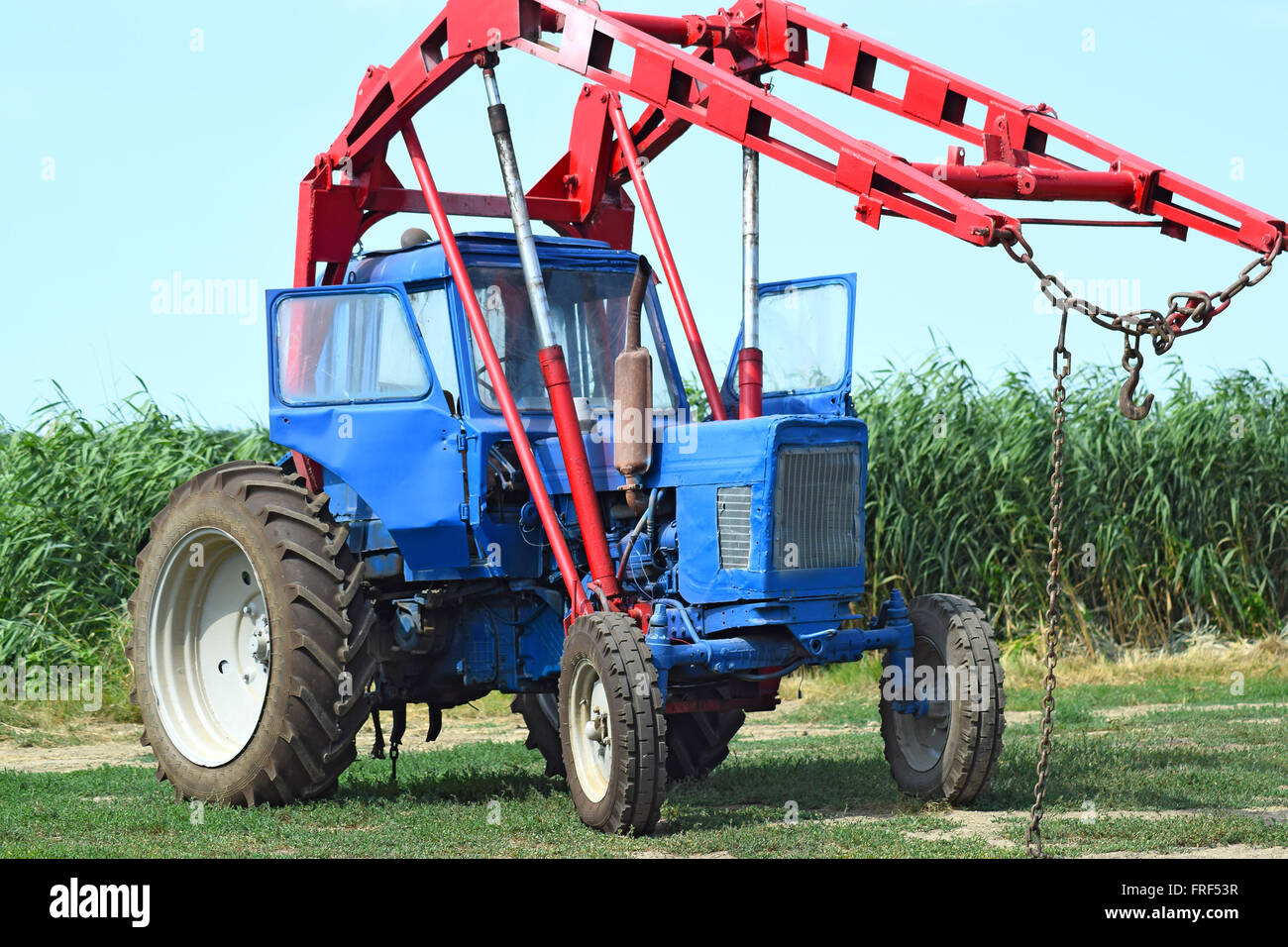 Tractor to collect hay. Stacker mounted on the tractor. Parking of ...