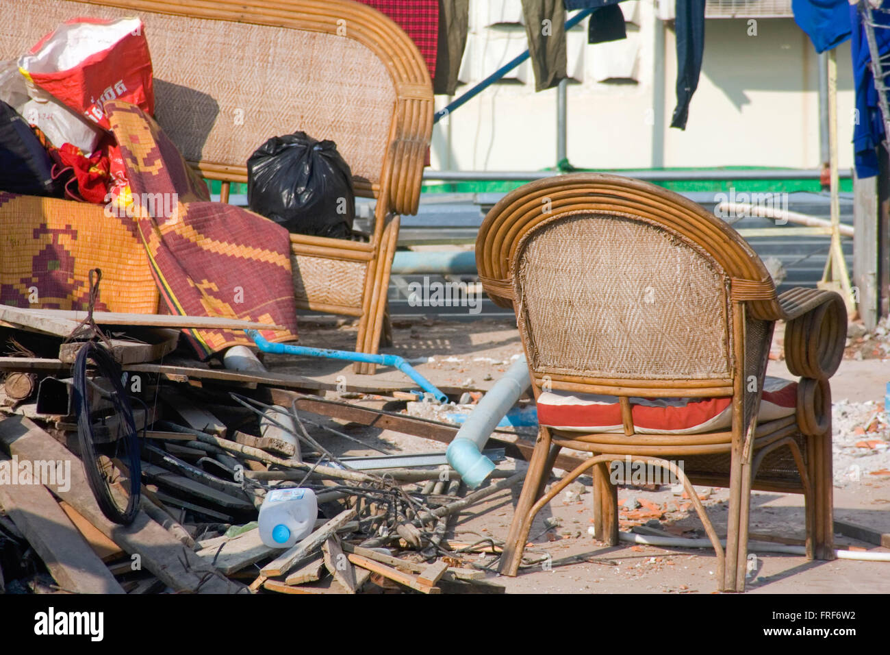 A chair used by construction workers sits on a building under ...