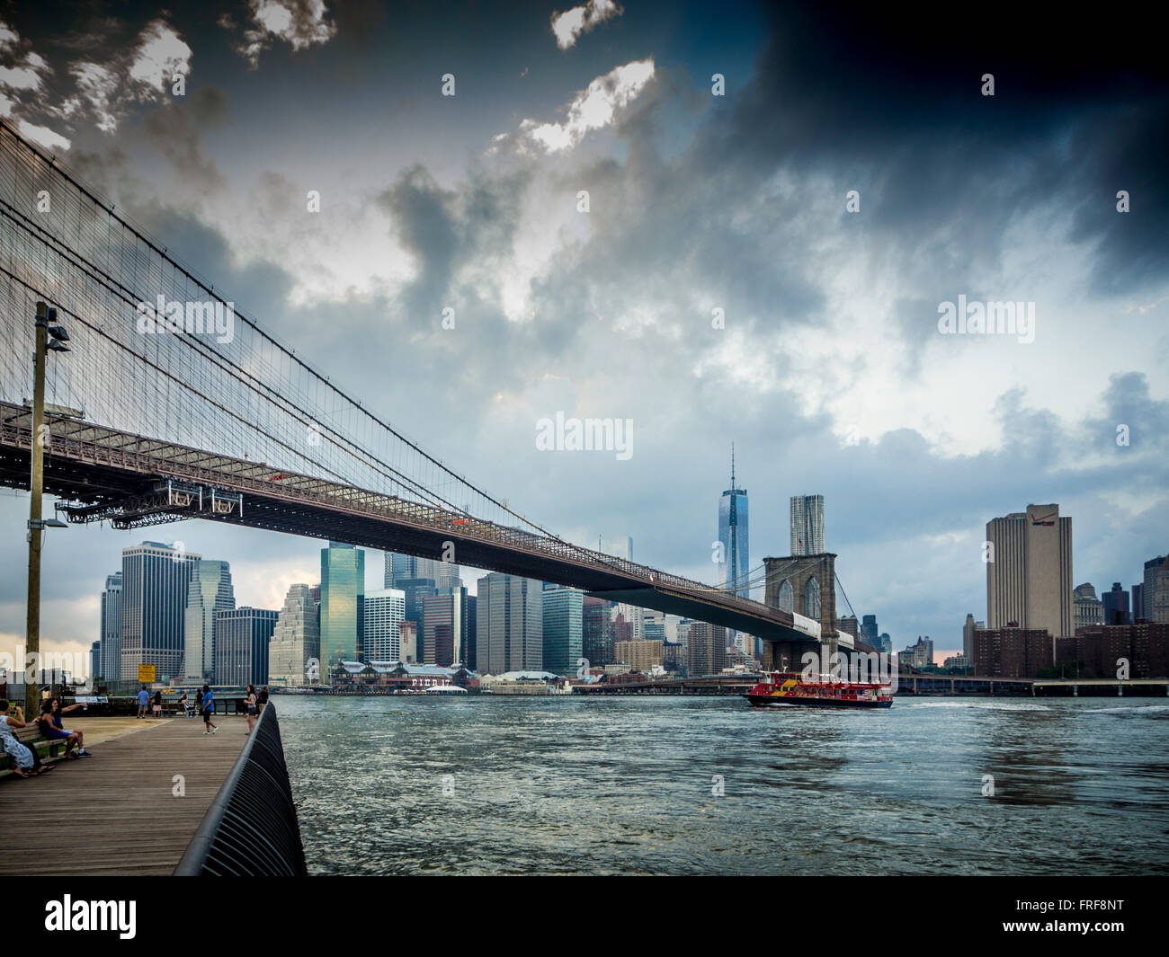 Tourist sightseeing boat, Manhattan skyline and Brooklyn Bridge, New ...