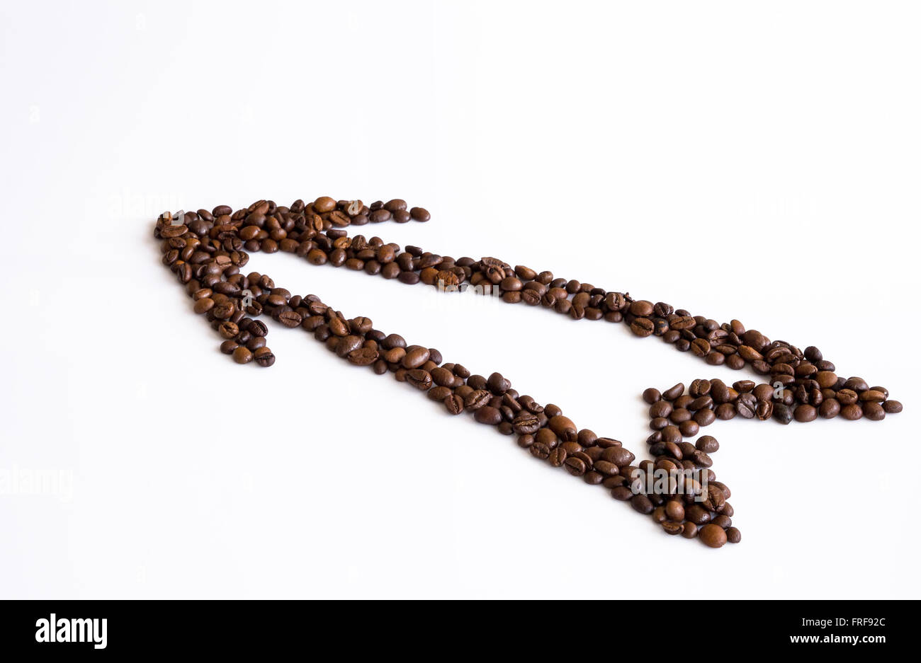 Arrow made from coffee beans.Isolated Stock Photo - Alamy
