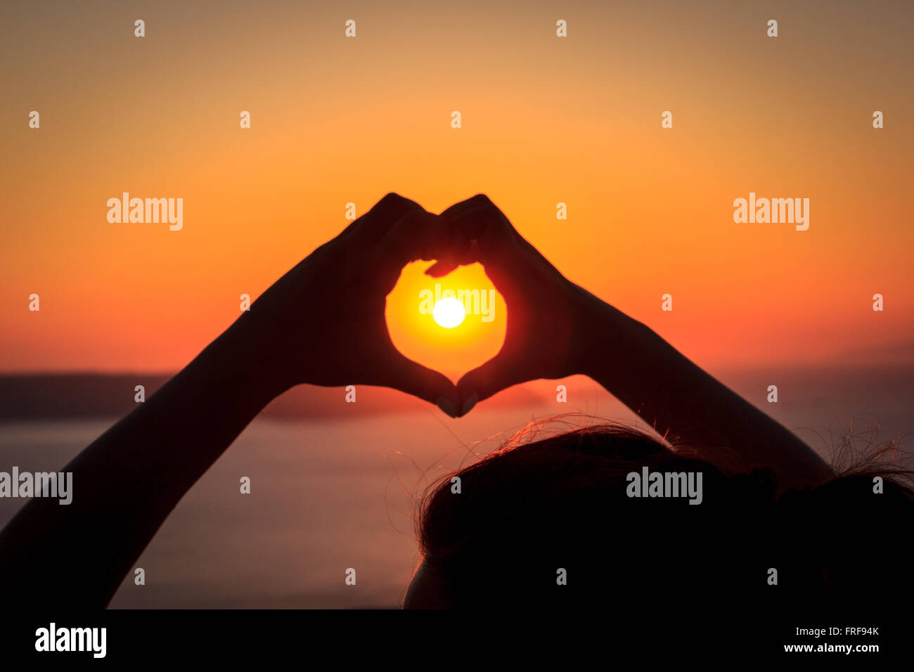 Heart shape shadow made hands hi-res stock photography and images - Alamy