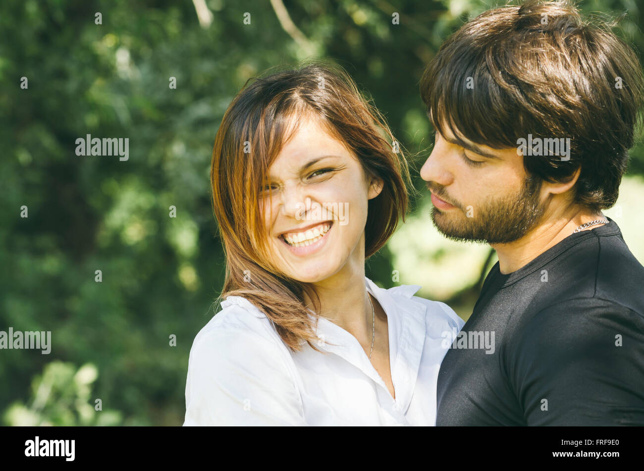 Happy couple hugging in nature Stock Photo - Alamy